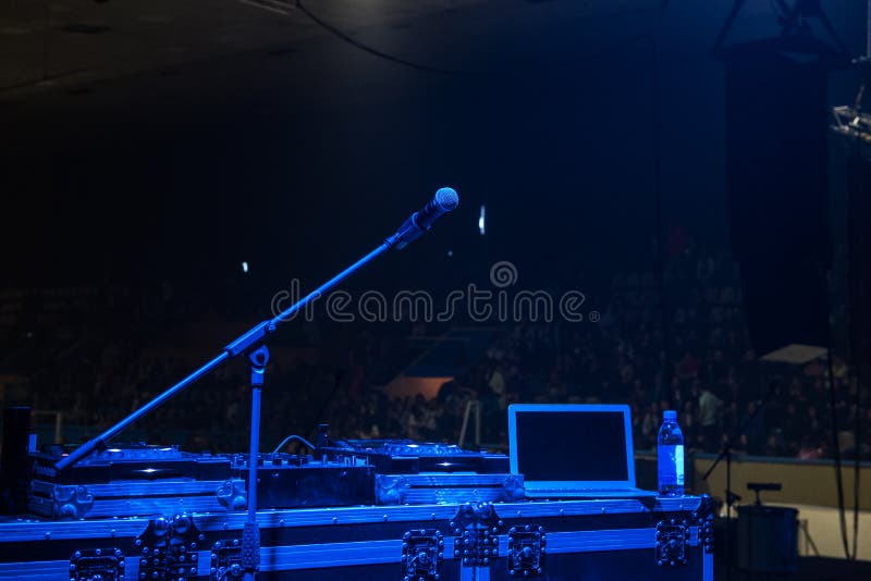 Microphone in Concert Hall with Blue Lights Stock Photo - Image of ...