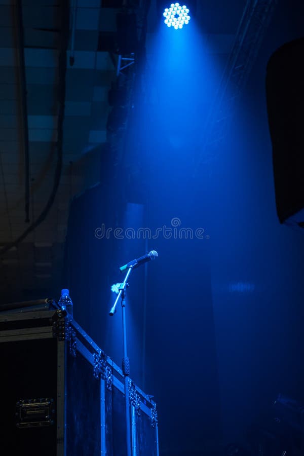 Microphone in Concert Hall with Blue Lights Stock Image - Image of ...