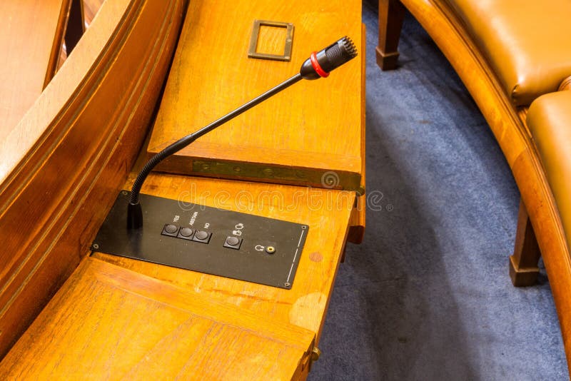 Microphone in Conference or Council Chamber on Wood Desk. Stock Image ...