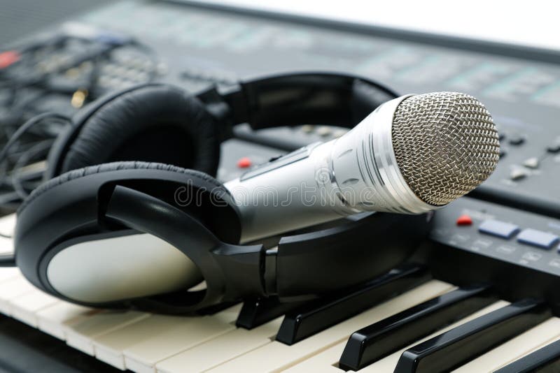 Microphone and Ear-phones on the Keyboard Stock Photo - Image of macro ...