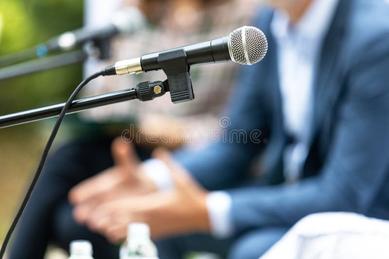 Microphone in Focus at Roundtable Meeting or Business Event Stock Photo ...