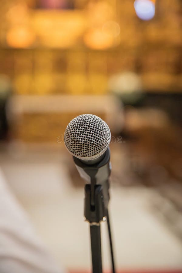 Microphone in the Foreground Ready To Be Used Inside a Church or ...