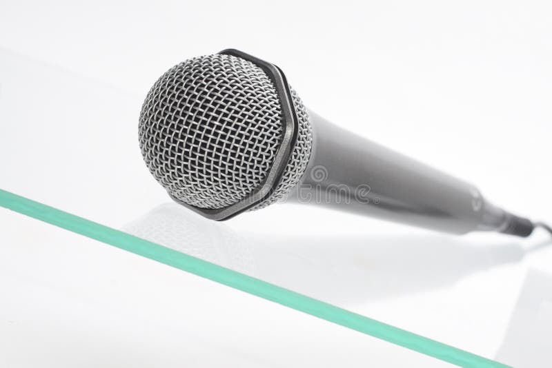 Microphone on the Glass Table Stock Photo - Image of sloping, slanting ...