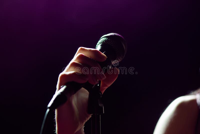 Microphone in Hand Singer on the Stage. Stock Photo - Image of holding ...