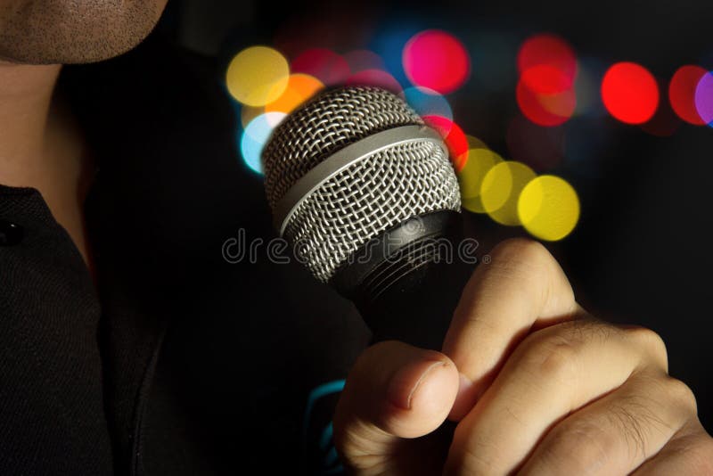 Microphone in human hand. stock photo. Image of music - 45976360