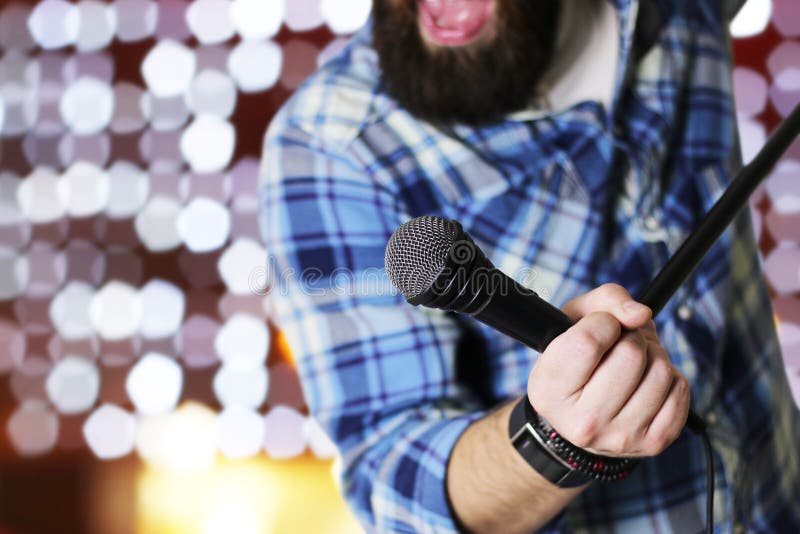 Man Singing Pose Holding Microphone Stock Photos - Free & Royalty-Free ...