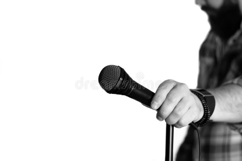 Man Singing Pose Holding Microphone Stock Photos - Free & Royalty-Free ...