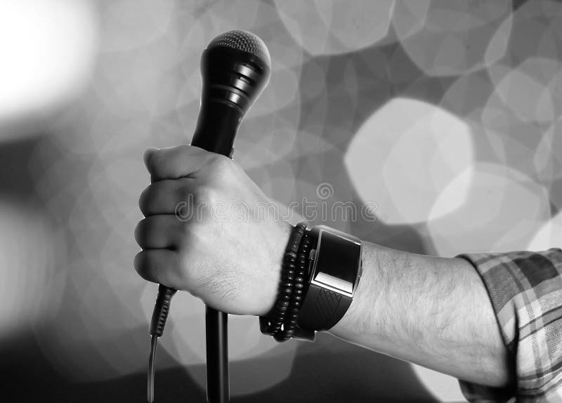 Man Singing Pose Holding Microphone Stock Photos - Free & Royalty-Free ...