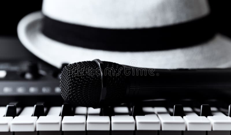 Microphone on keyboard . stock image. Image of play - 196078291