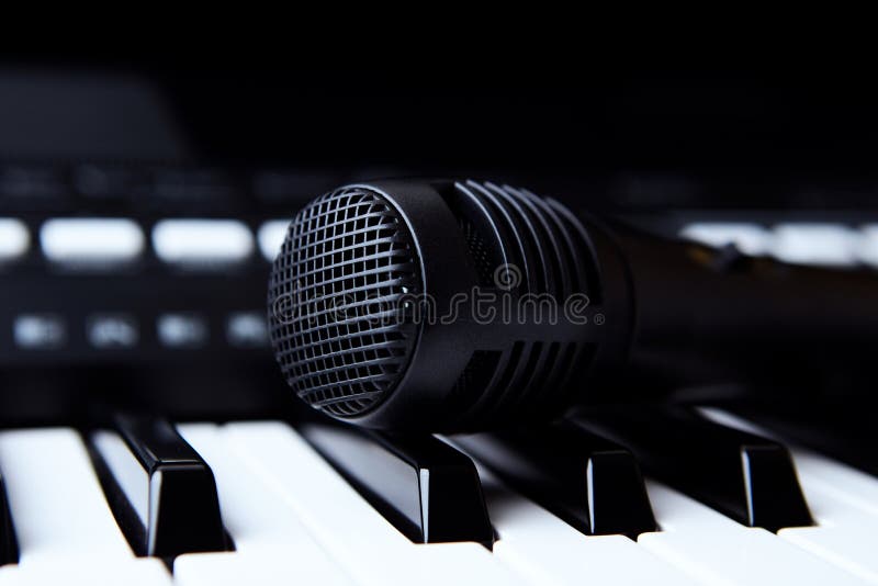 Microphone on keyboard. stock photo. Image of organ - 308690066