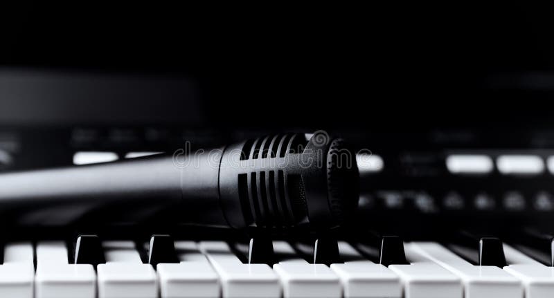 Microphone on keyboard . stock photo. Image of microphone - 196066980