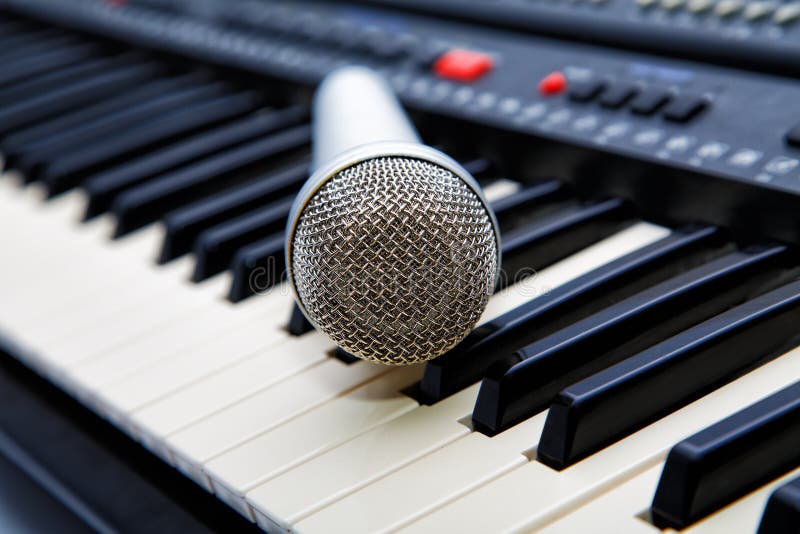 The Microphone Lies on the Synthesizer Stock Image - Image of audio ...