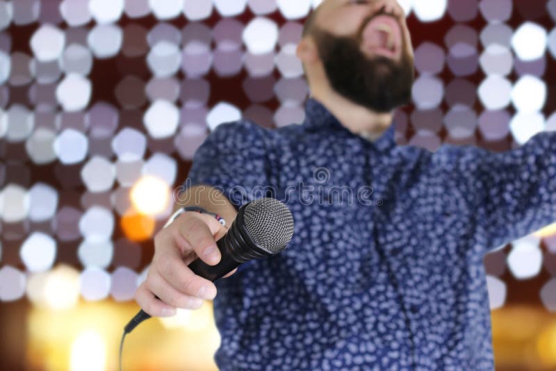 Man Singing Pose Holding Microphone Stock Photos - Free & Royalty-Free ...