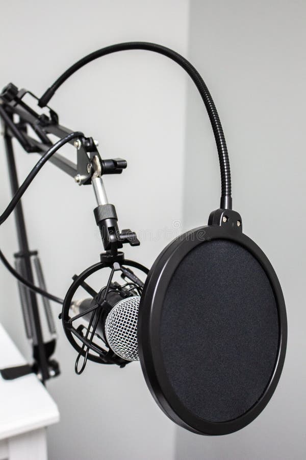 A Microphone and Pop Filter Await Your Voice Stock Photo - Image of ...