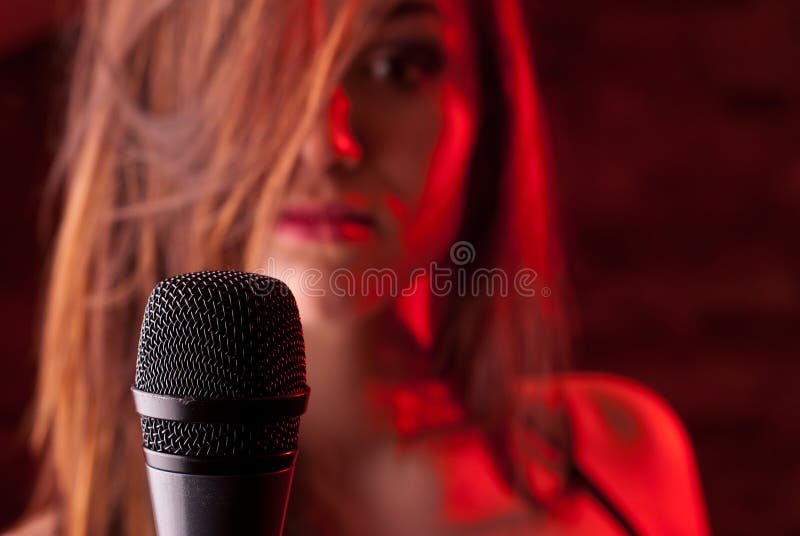 Woman Singer with Microphone Stock Photo - Image of elegant, holding ...