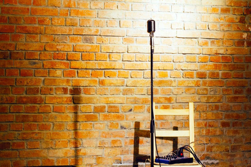 Microphone Ready on Stage Against a Brick Wall Ready for the Karaoke ...