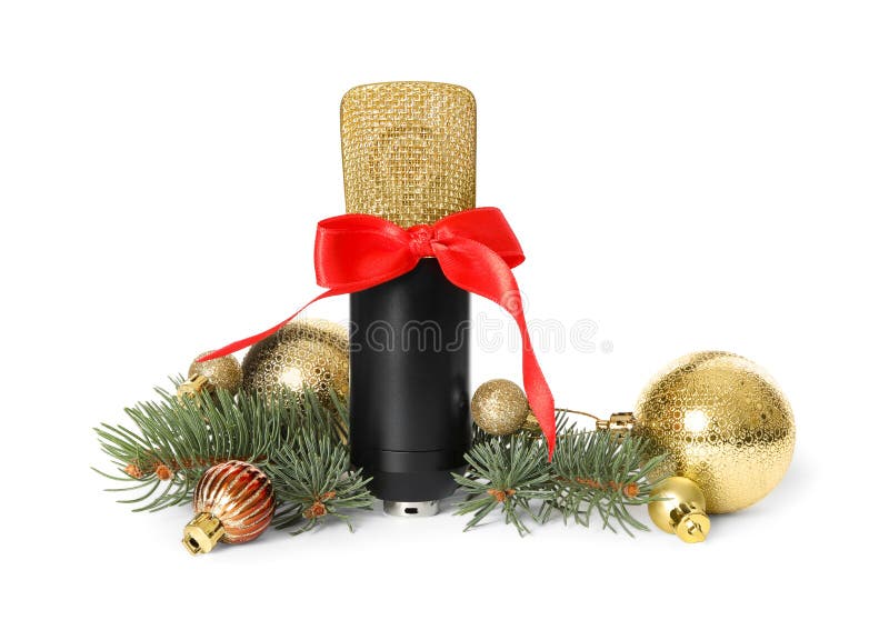 Microphone with Red Bow and Fir Branches Against Blurred Lightst ...
