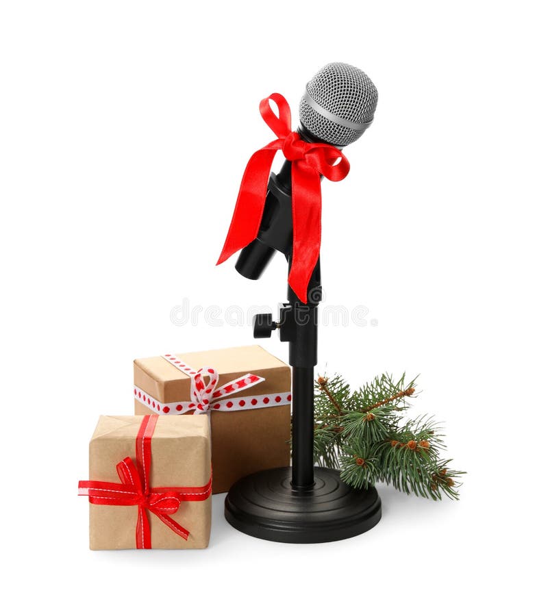 Microphone with Red Bow and Fir Branches Against Blurred Lightst ...