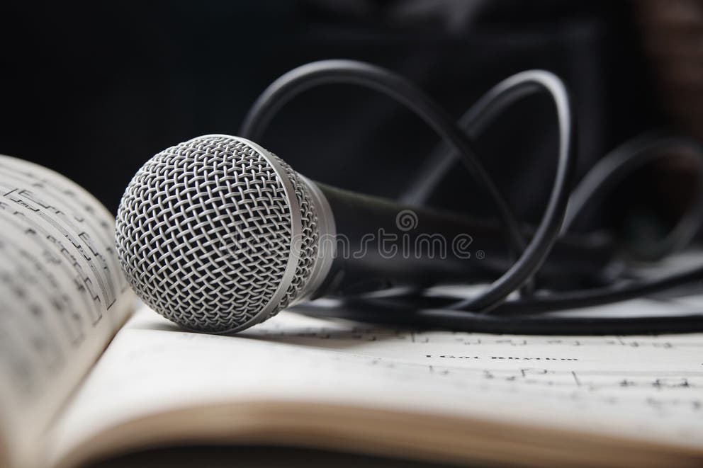 Microphone on Sheet of Music Stock Image - Image of black, metal: 50173849