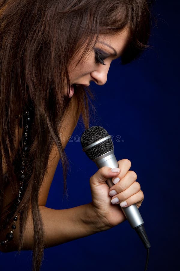 Female singing into mic. stock photo. Image of adult, sound - 2768364
