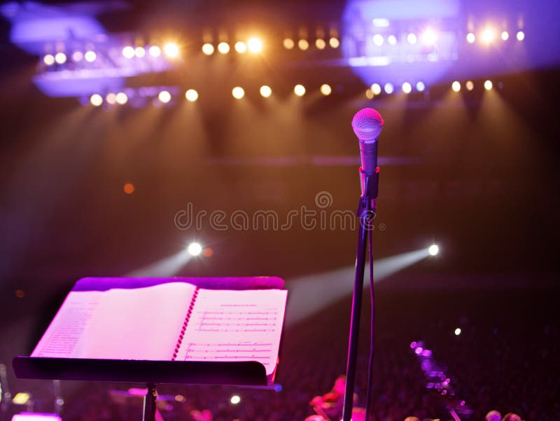 Microphone on Stage with Lights in Background Stock Image - Image of ...