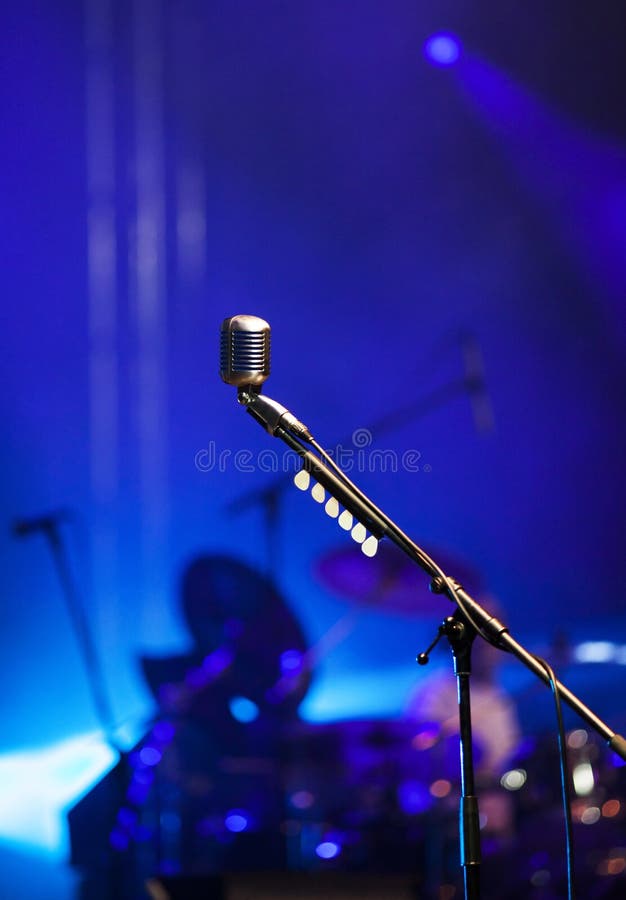 Microphone in stage lights stock photo. Image of club - 34019258