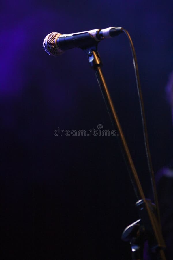 Microphone in stage lights stock photo. Image of equipment - 34019292