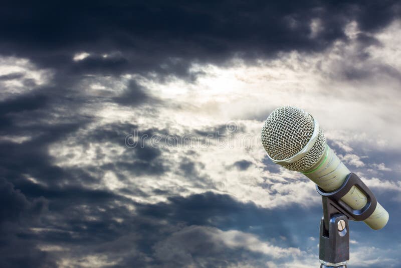 Microphone on a Stand with Blurred Dark Gray Big Cloud before Ra Stock ...