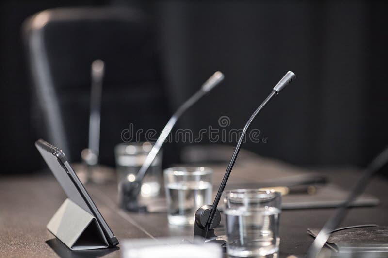 Microphone and Tablet Placed on Table in Meeting Room of Local ...