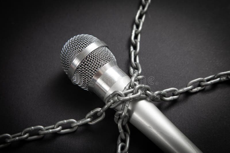 Microphone Tied with Chains on the Black Background Stock Photo - Image ...
