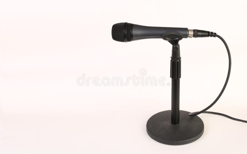 A Microphone on the Ground and Blurred Photo of Conference Hall or ...
