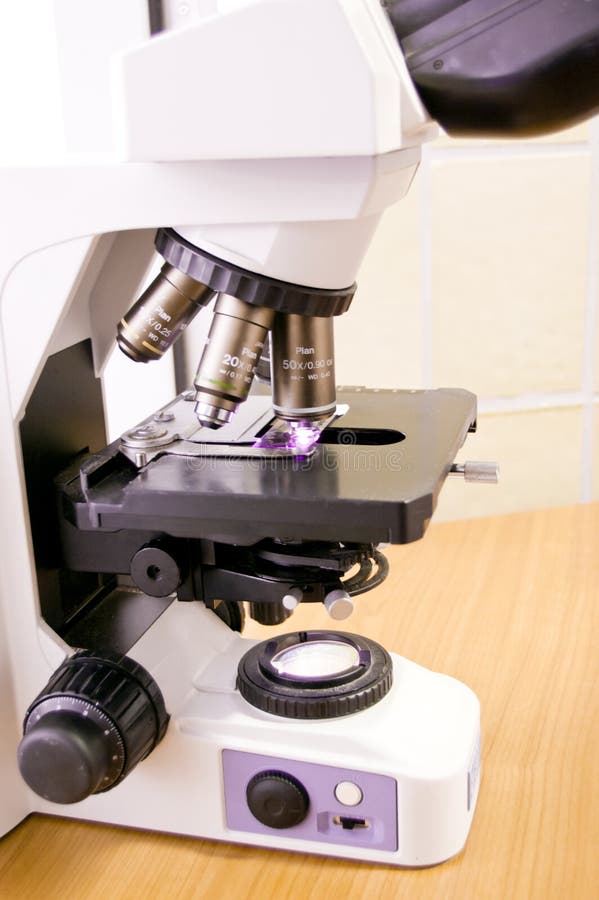 Microscope Analyzing Cells in a Blood Sample Stock Photo - Image of ...