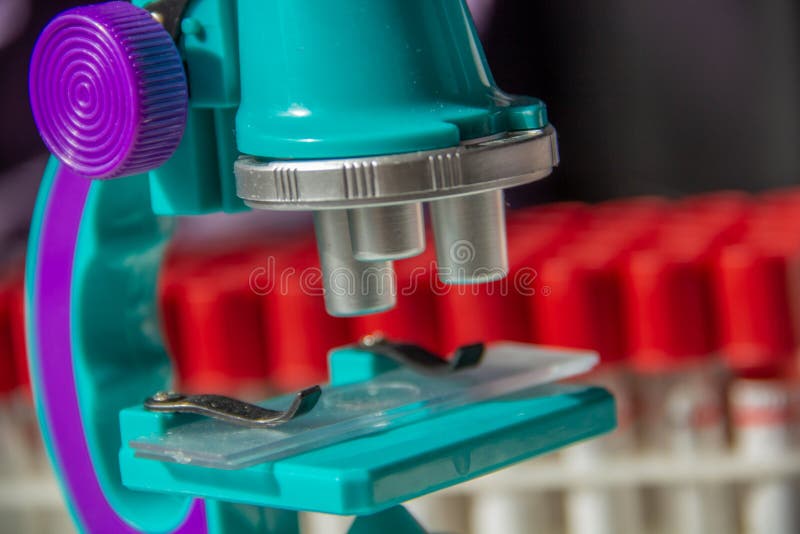 Microscope on the Background of Test Tubes for Blood Tests for Viruses ...