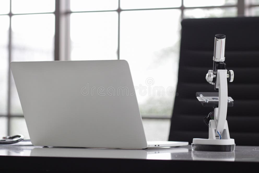 Microscope and Computer at Working Room. Science Concept. Stock Photo ...