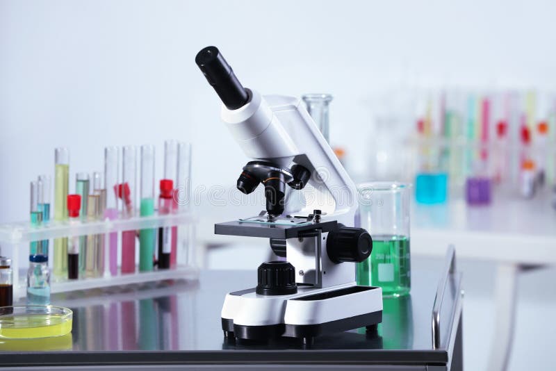 Modern Microscope with Glass Slide on Metal Table in Laboratory Stock ...
