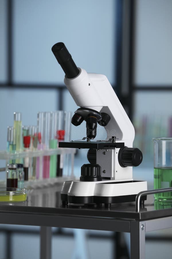 Modern Microscope with Glass Slide on Metal Table in Laboratory Stock ...