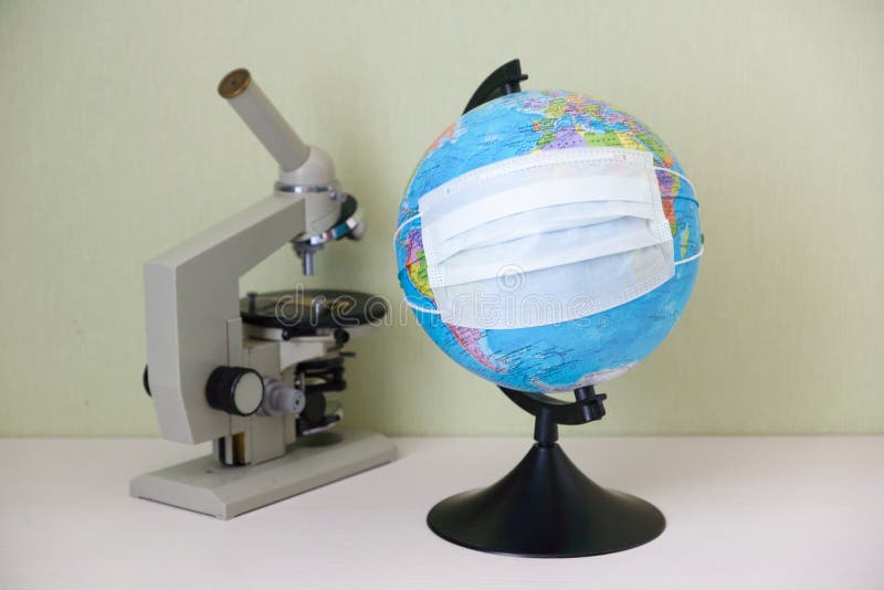 Microscope and Globe with a Protective Mask Stock Photo - Image of ...