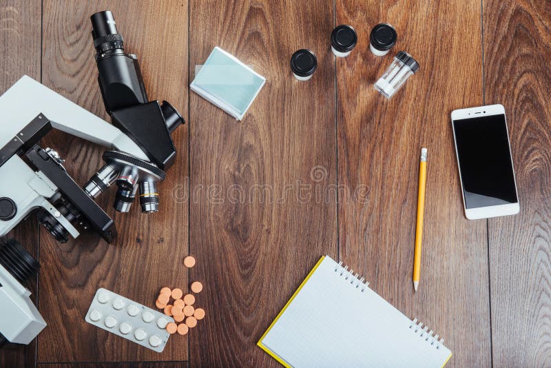 Microscope Image Notebook and Phone Close-up. Stock Image - Image of ...
