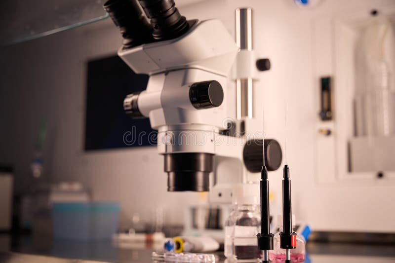 Microscope and Lab Equipment Under Vibrant Colored Lights Stock Photo ...