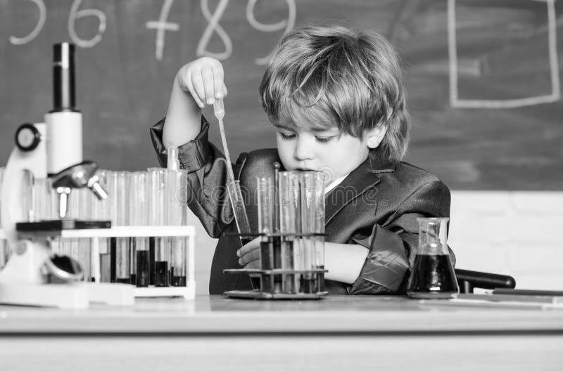 Microscope at Lab. Small Boy Using Microscope at Lesson. Student Do ...