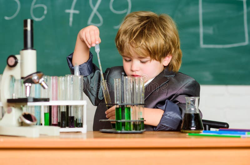 Microscope at Lab. Small Boy Using Microscope at Lesson. Student Do ...