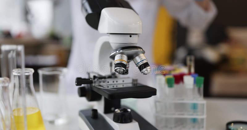Microscope in the Laboratory with Test Tubes and the Work of Scientist ...