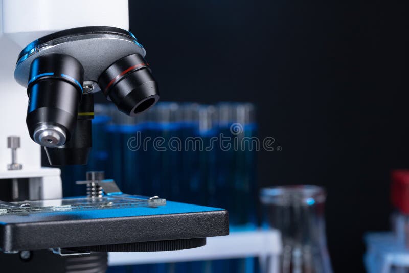 Microscope with Lenses Close Up Against Dark Background Stock Photo ...