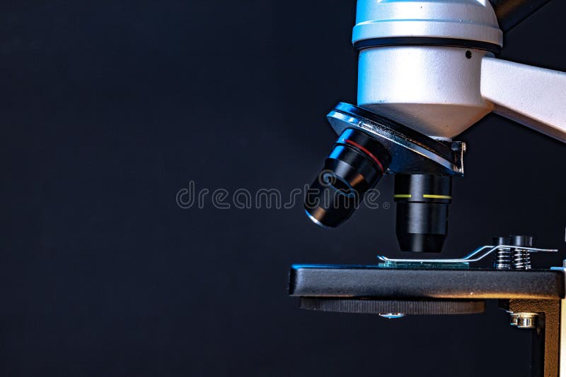 Microscope with Lenses Close Up Against Dark Background Stock Photo ...