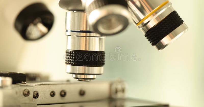 Microscope with Lenses for Zooming in on Table in Laboratory Stock ...