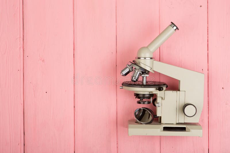 Microscope on pink wood stock image. Image of view, research - 113389835