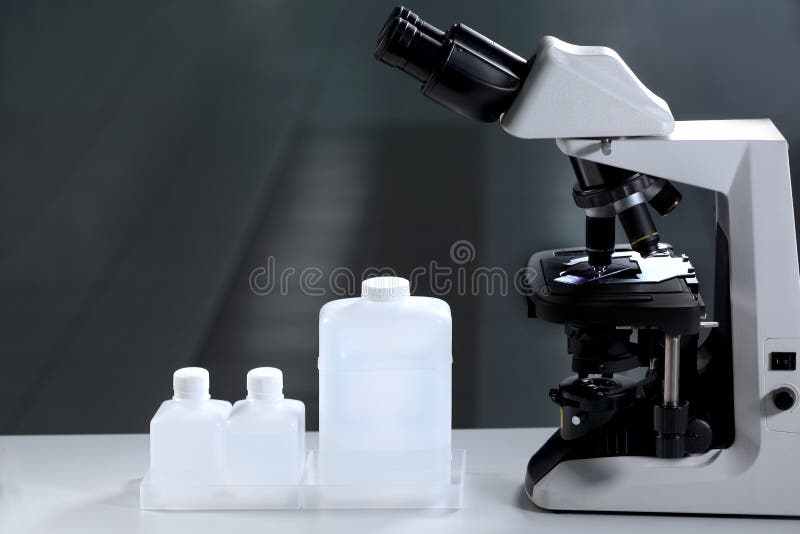 Microscope and Plastic Bottles in the Clinical Diagnostic Laboratory ...