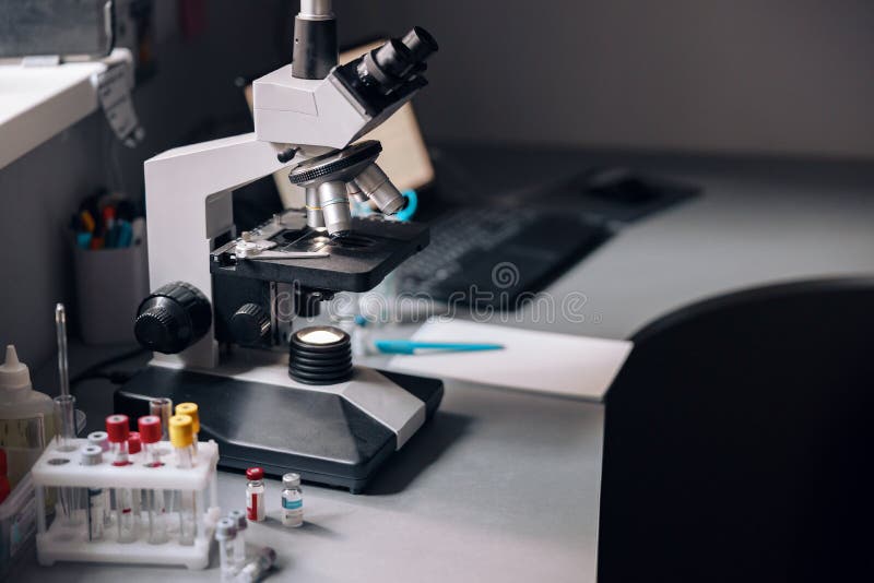 Microscope, Rack with Test Tubes and Vials on Table in Laboratory Stock ...