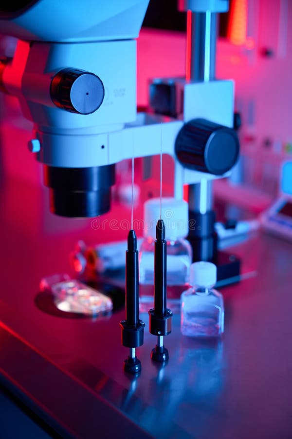 Microscope Setup Illuminated by Red and Blue Lab Lights Stock Photo ...