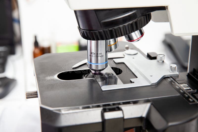 Microscope Slide with Pap Smear Sample on the Microscope for Scientist ...